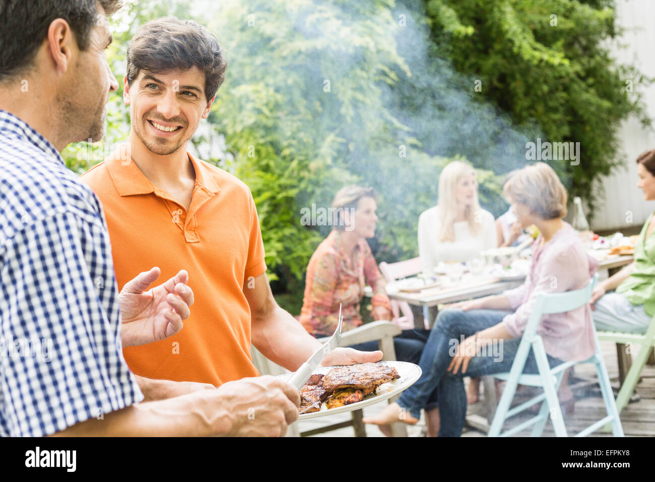 Man woman talking barbecue hi-res stock photography and images - Alamy