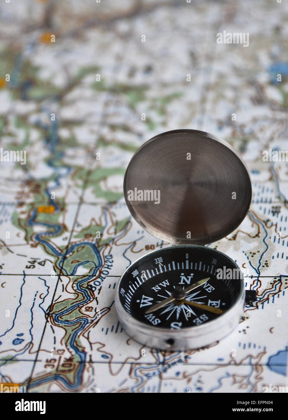 The magnetic compass is located on a topographic map. Satellites ...