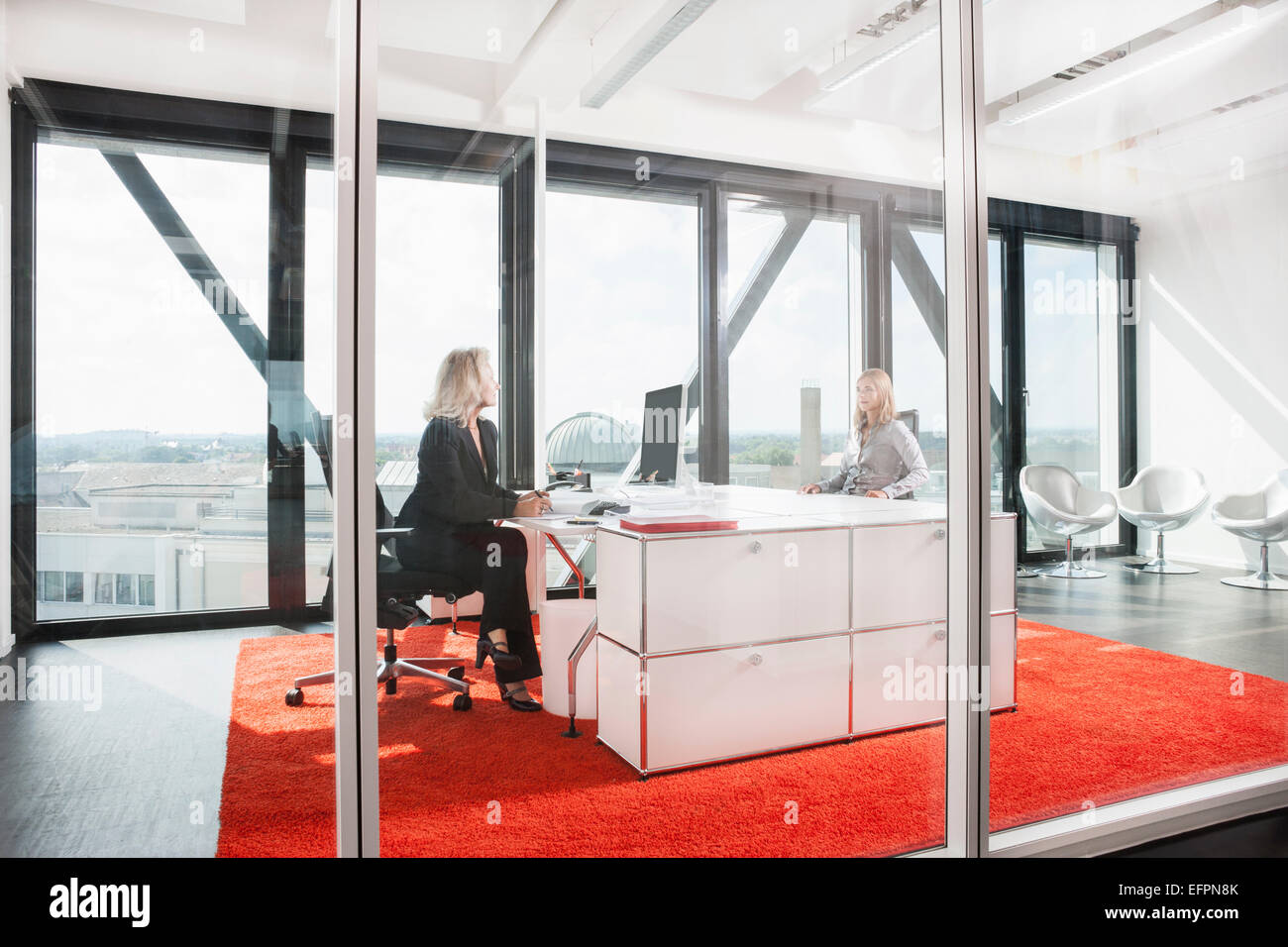 Two women working in office Stock Photo - Alamy