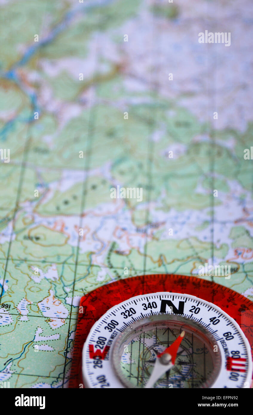 The magnetic compass is located on a topographic map. Equipment for ...