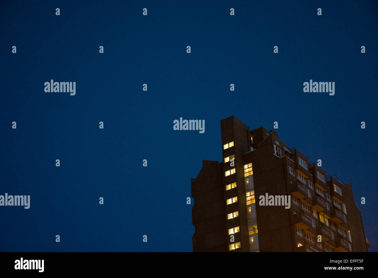 Residential tower block at night with windows illuminated, Stockwell ...