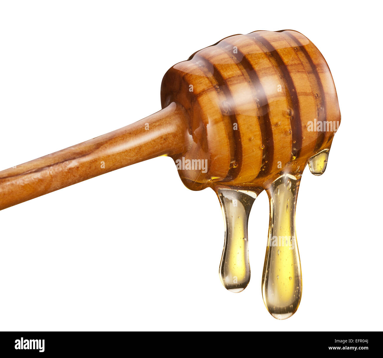 Honey droplets flowing from wooden stick. Clipping paths Stock Photo ...
