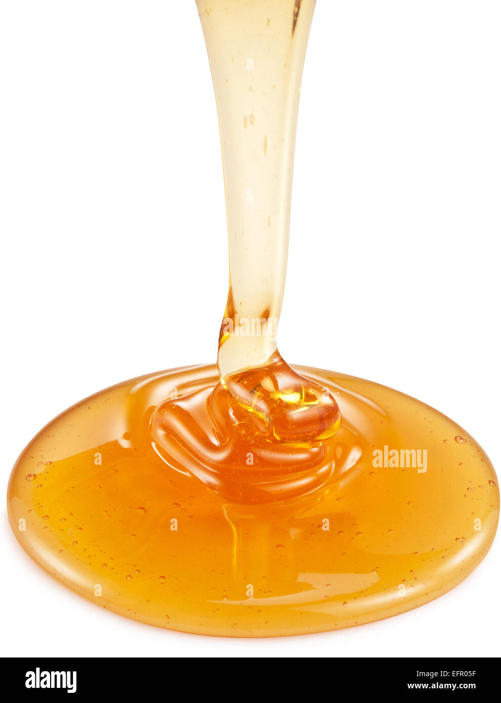 Honey flowing from wooden stick on white background. Clipping paths ...