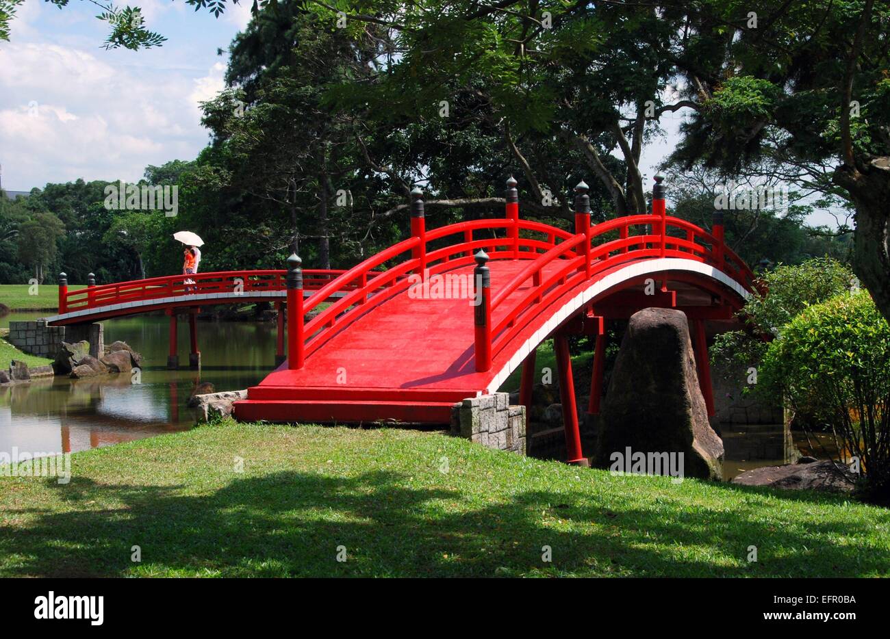 Singapore: Two graceful orange Japanese wooden bridges spanning a ...