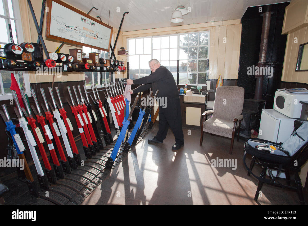 The signalman at Williton station on the West Somerset Railway at work ...