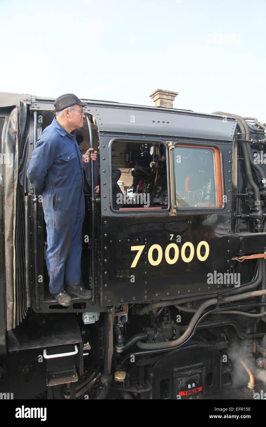 The driver of ex BR loco No.70000 'Britannia' at Williton station, West ...