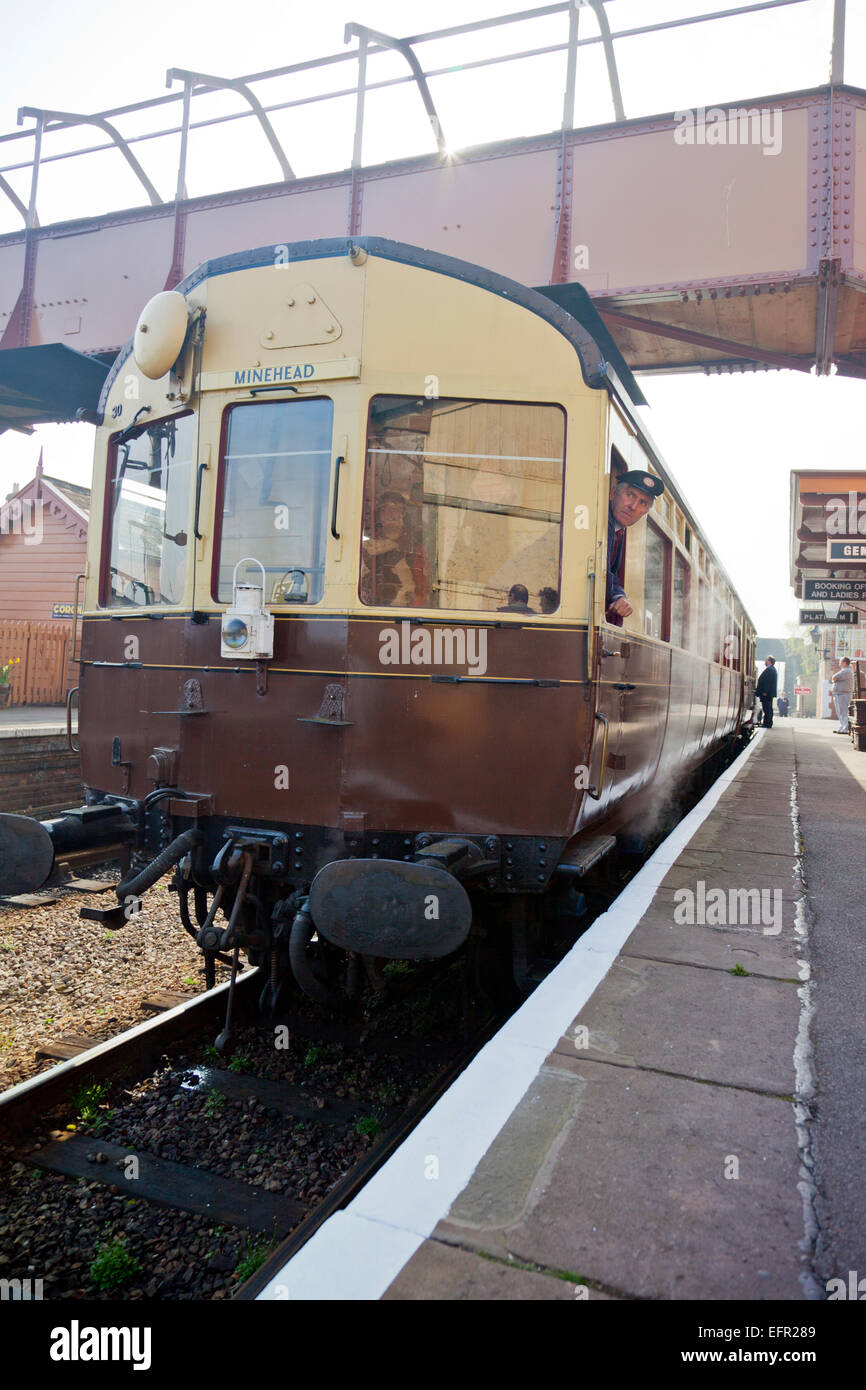The driver of ex-GWR 'Autocoach' prepares to leave Williton station on ...
