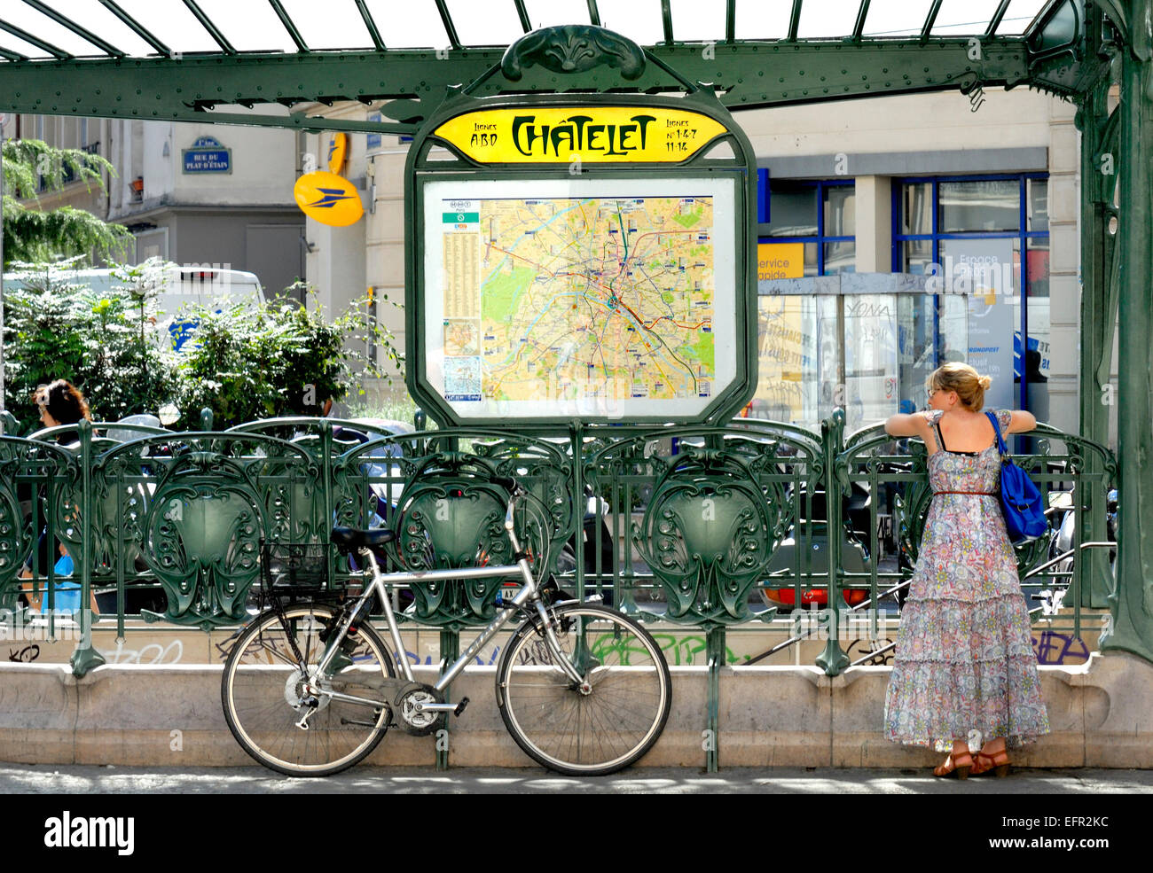 Paris, France. Metro sign, map, bicycle and young woman - Chatelet ...