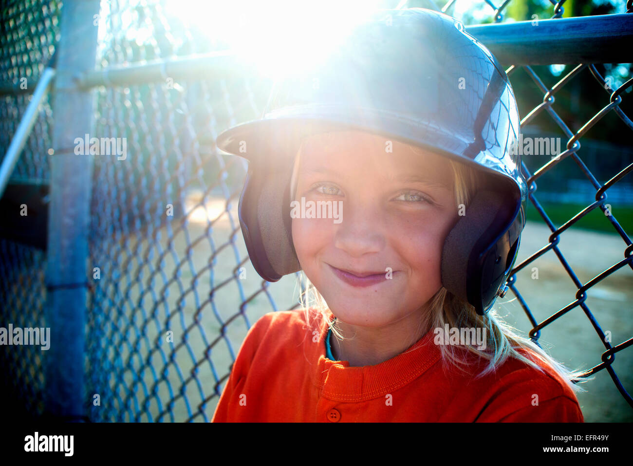 Portrait of young girl wearing baseball kit Stock Photo - Alamy