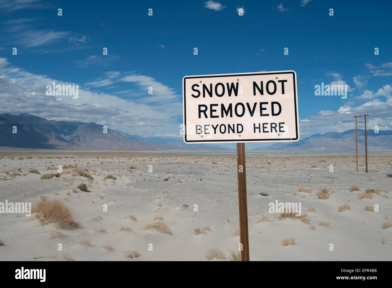 Snow warning sign in desert, Death Valley, California, USA Stock Photo ...