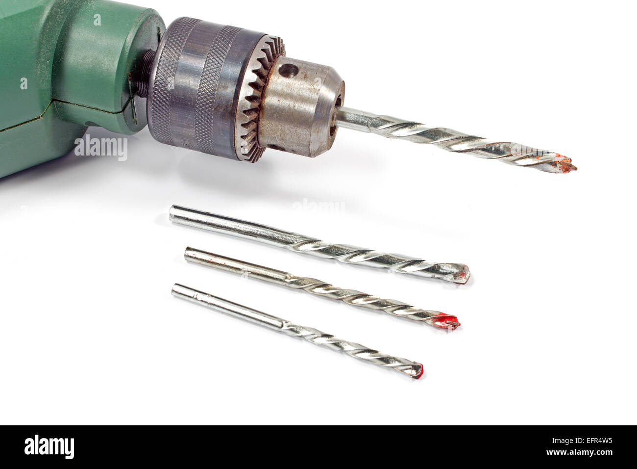 Drill and set of drill bits on white Stock Photo - Alamy