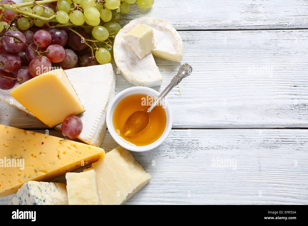 Delicious cheeses with honey, tasty food Stock Photo - Alamy