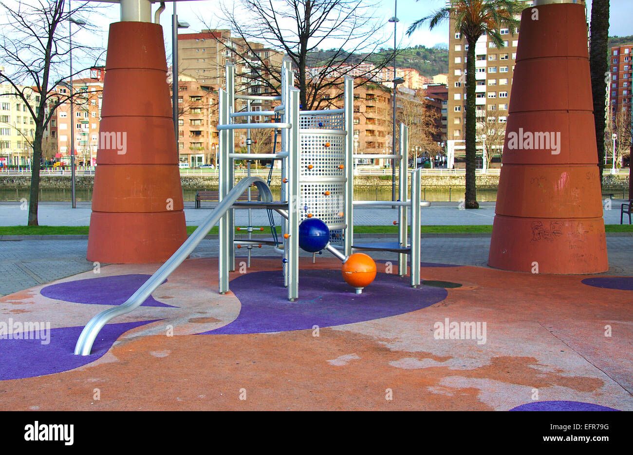 View of children playground in an urban background Stock Photo - Alamy
