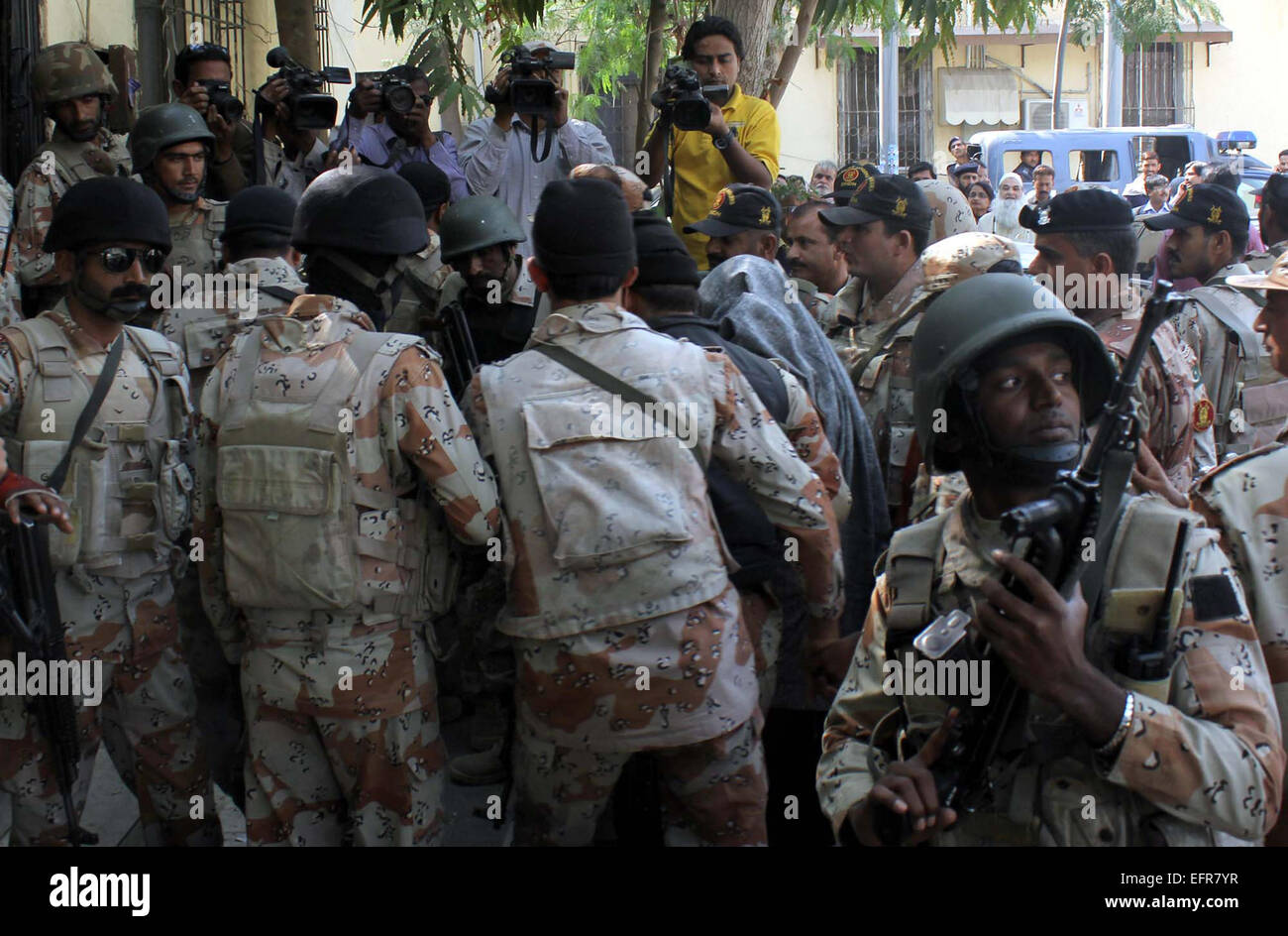 Rangers staffs escorting accused Abdul Rafiq, the key suspect behind ...