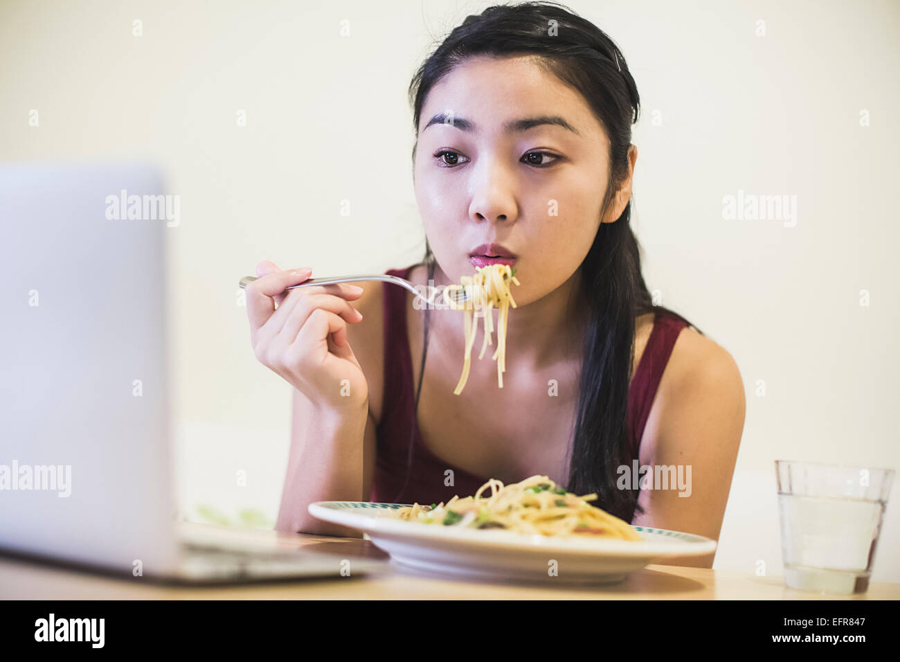 Asian person eating noodles hi-res stock photography and images - Alamy