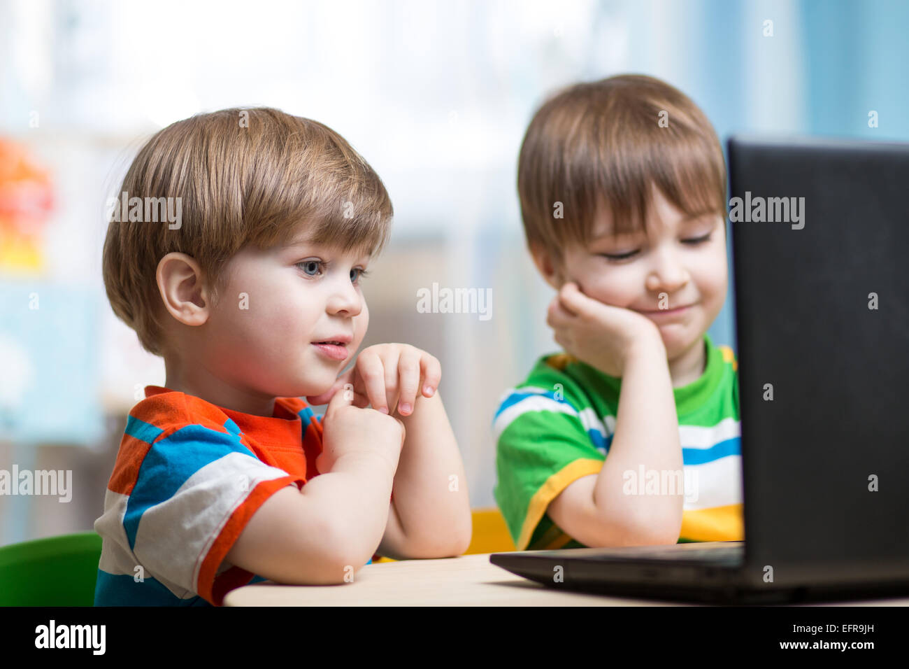 happy children looking at laptop Stock Photo - Alamy