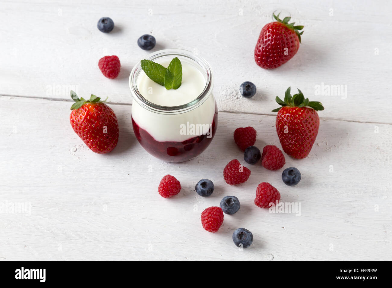 Red fruit compote with mint leaves and fruit Stock Photo - Alamy