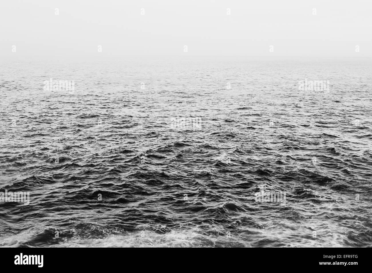 Heavy fog lifting from the choppy waters of the Pacific Ocean Stock ...