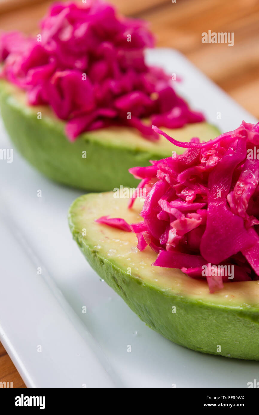 serving of fermented or cultured purple cabbage paired with an avocado ...