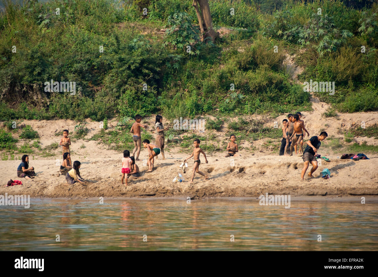 Horizontal view of a group of children playing and relaxing on the ...