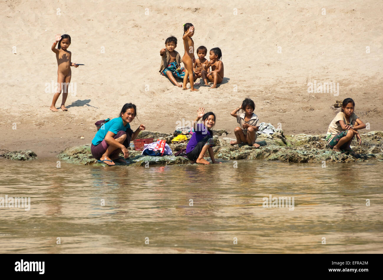 Horizontal view of a group of children playing and relaxing on the ...