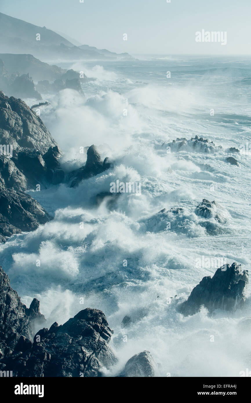 The Pacific Ocean coastline, with waves crashing against the shore ...