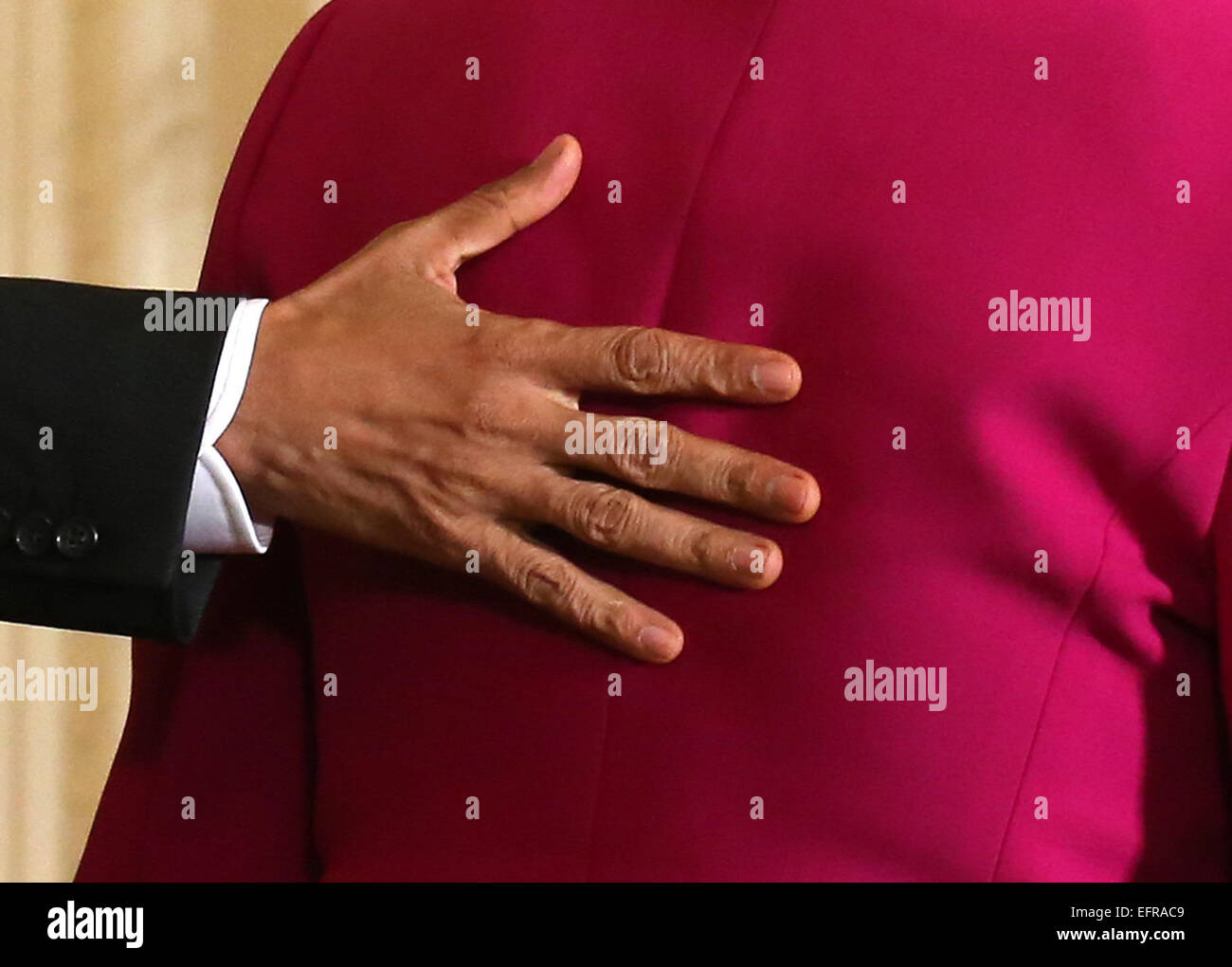 Washington DC, USA. 09th Feb, 2015. Obamas hand on the back of German ...