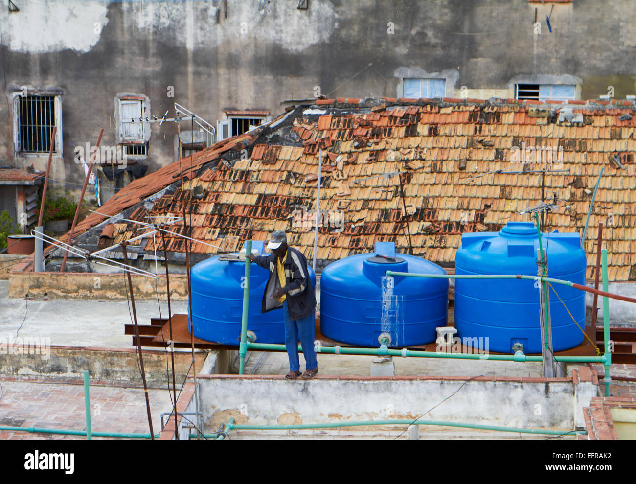 Man on roof hi-res stock photography and images - Alamy
