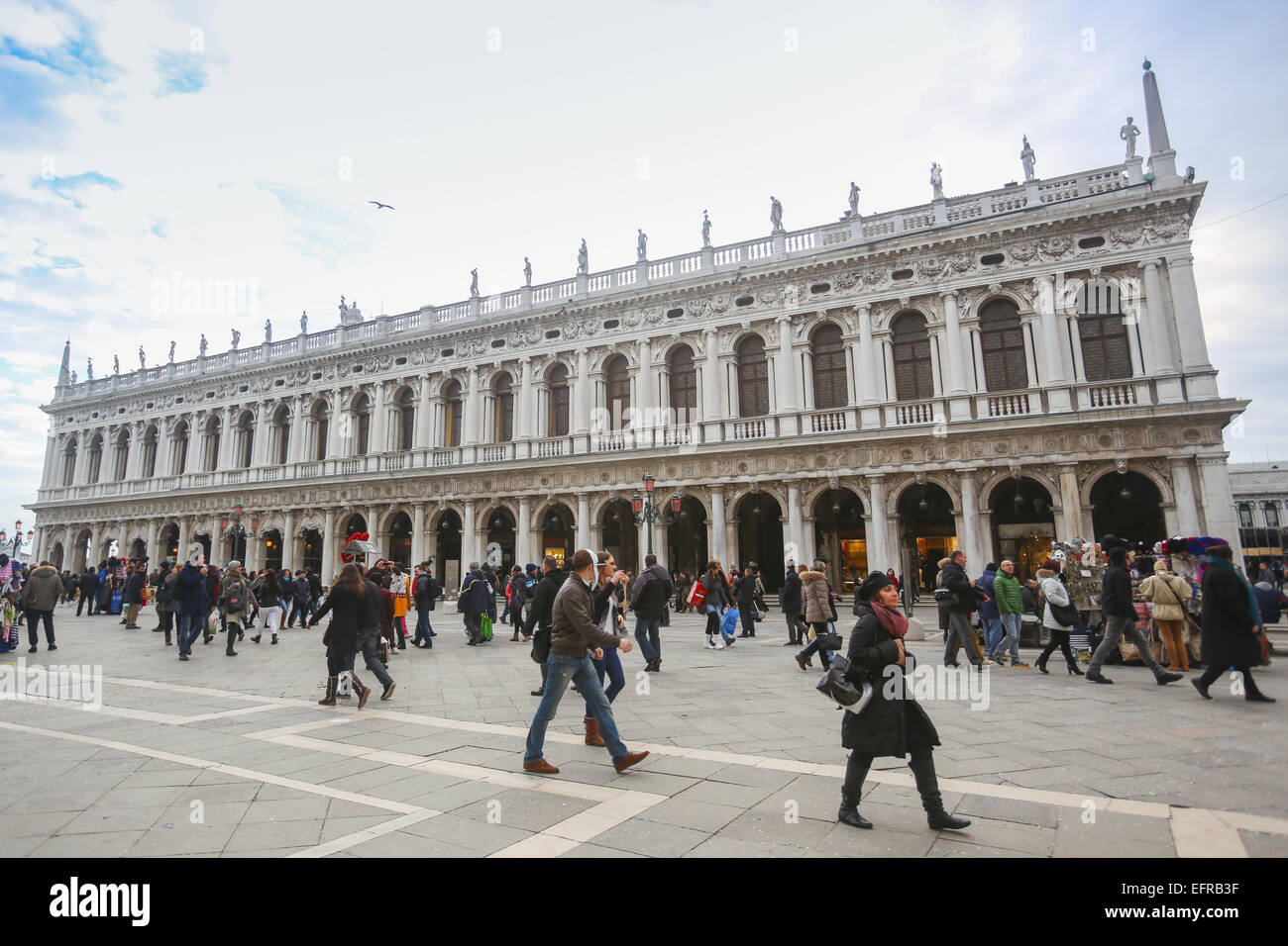 People walking in front of the National Library of Saint Mark in Venice ...