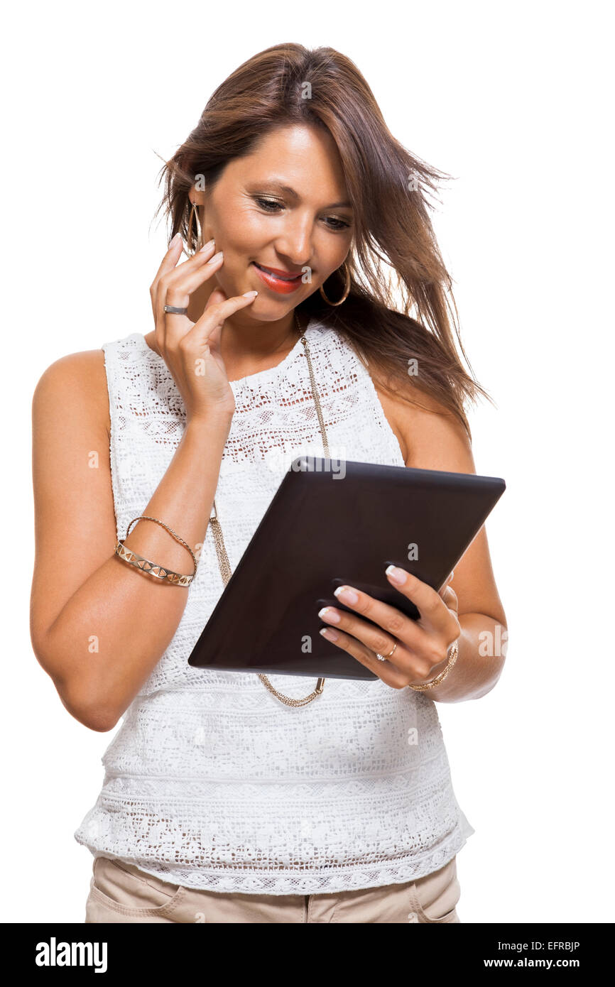 Attractive young business woman standing chatting on a mobile while ...