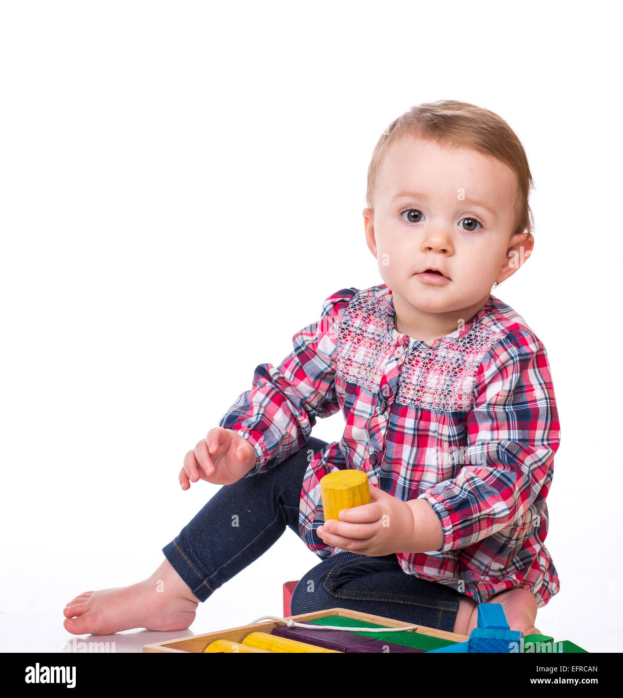Beautiful baby building a castle with cubes isolated on white Stock ...