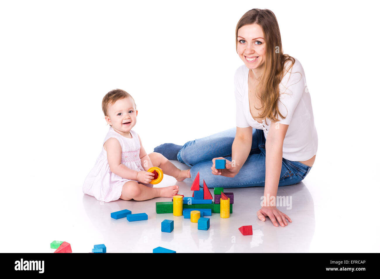 Beautiful baby with mother building a castle with cubes isolated on ...