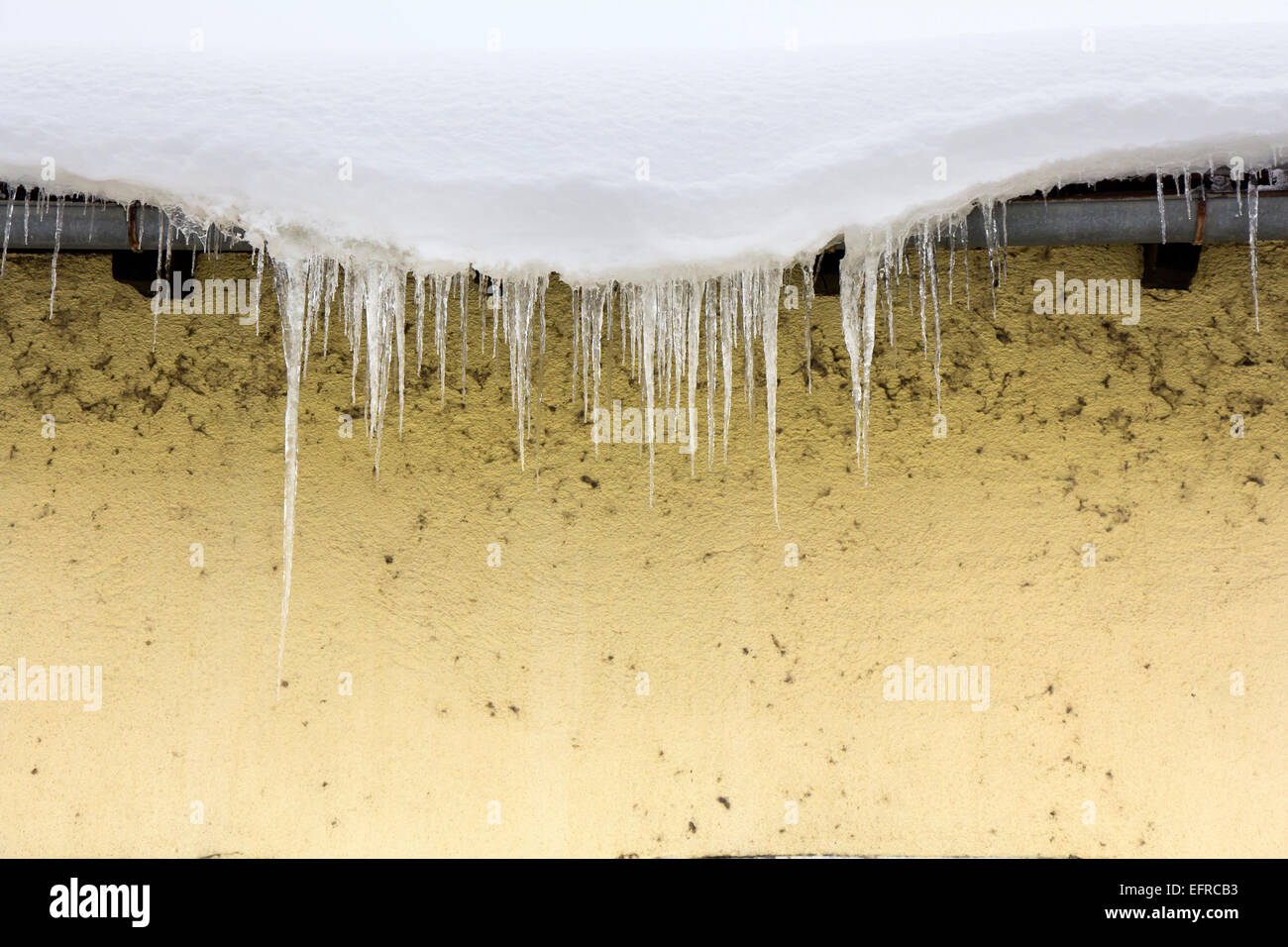 Icicles snow melting in roof hi-res stock photography and images - Alamy