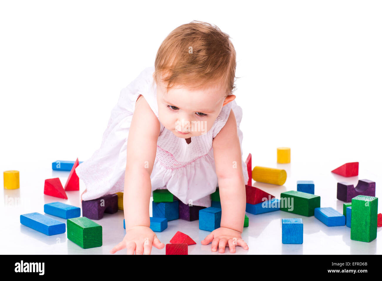 Beautiful baby building a castle with cubes isolated on white Stock ...