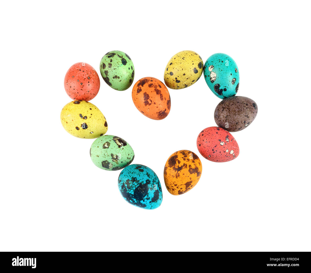 Heart of colorful painted quail eggs on a white background. Isolated ...