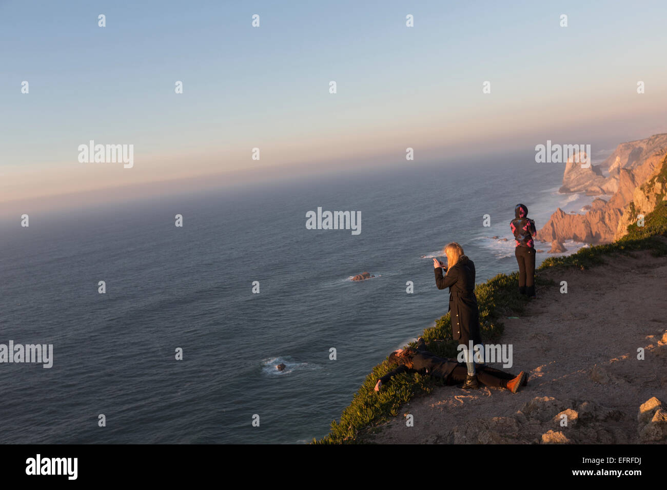 Tourist taking pictures Cabo da Roca sunset Stock Photo - Alamy