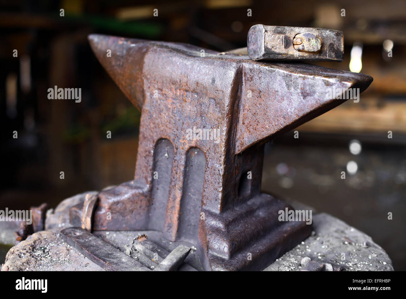 Color shot with a hammer and an anvil Stock Photo - Alamy