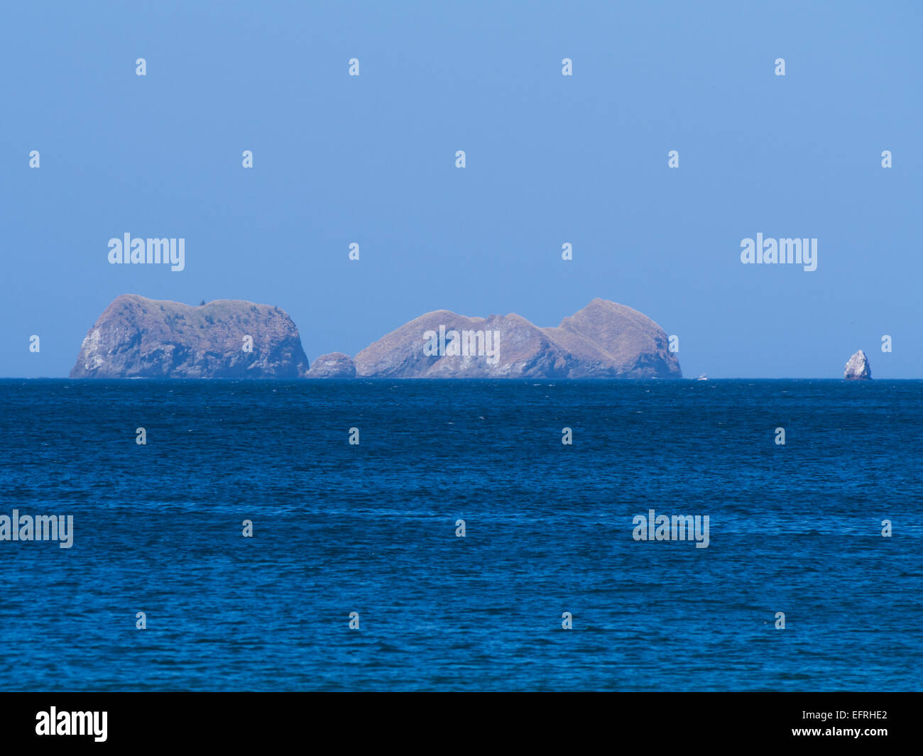 Ocean with land Stock Photo - Alamy