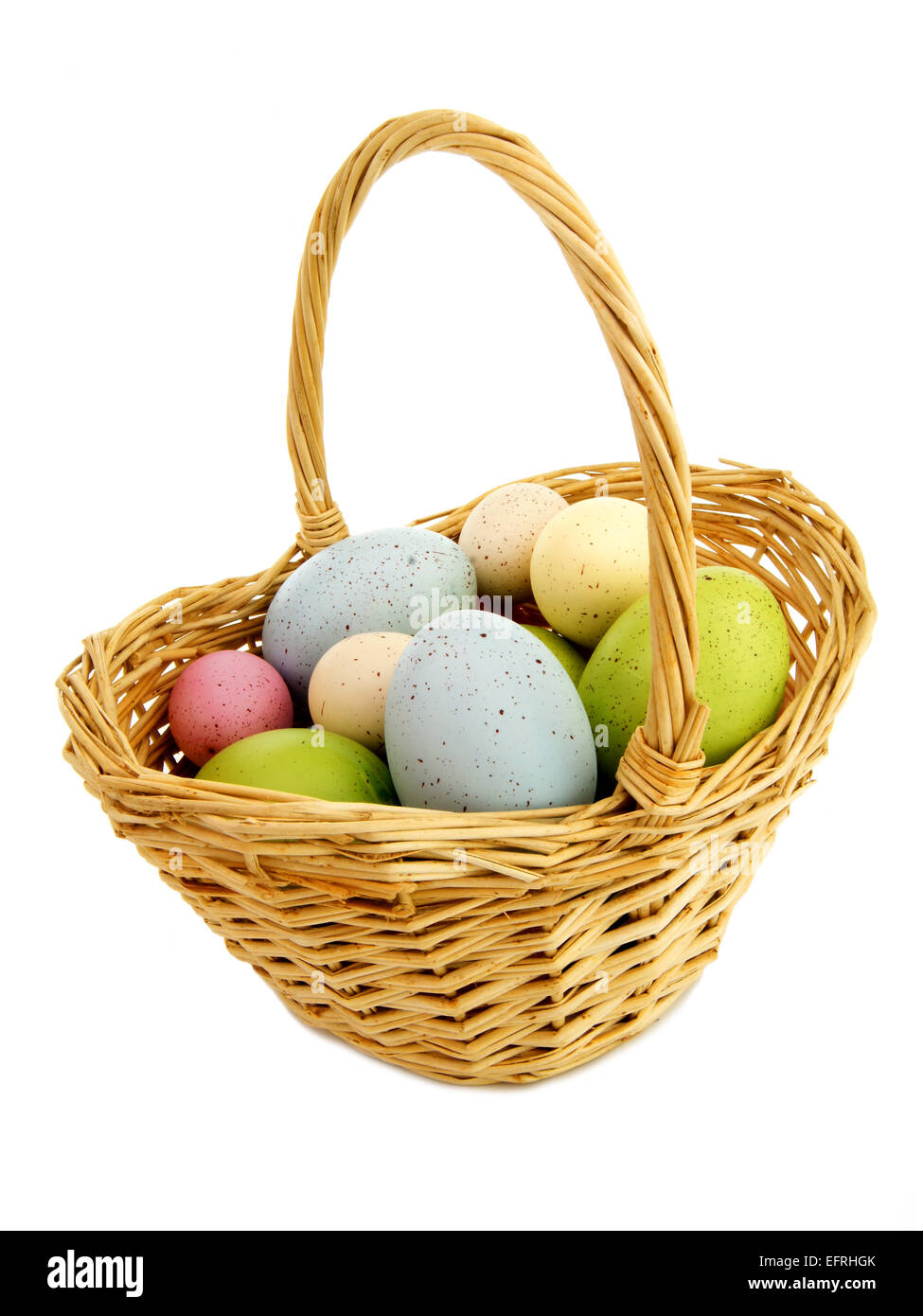Easter basket filled with colored eggs isolated on white Stock Photo ...