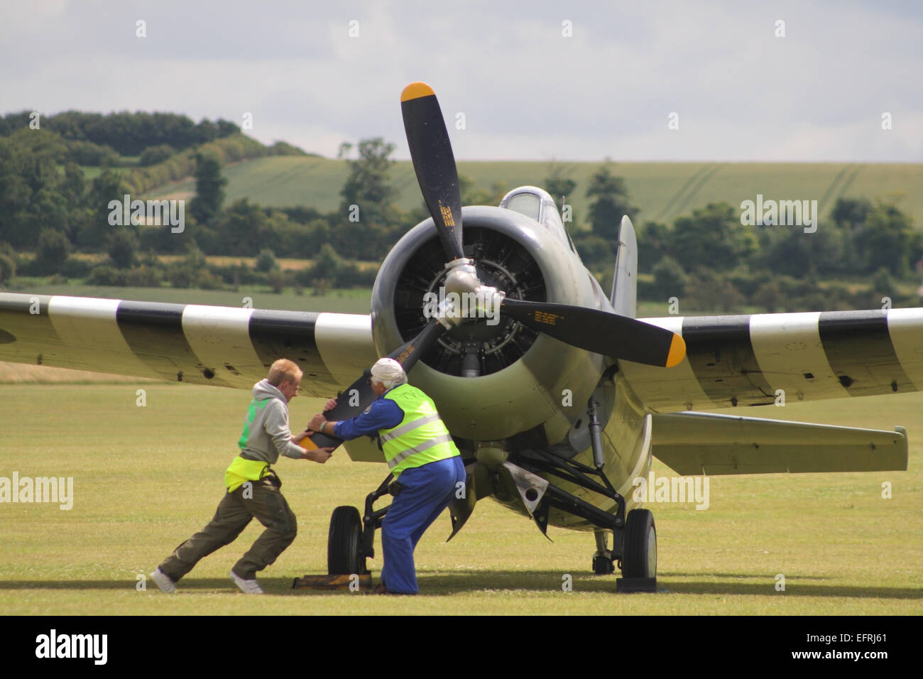 Spitfire turning prop by hand Stock Photo - Alamy