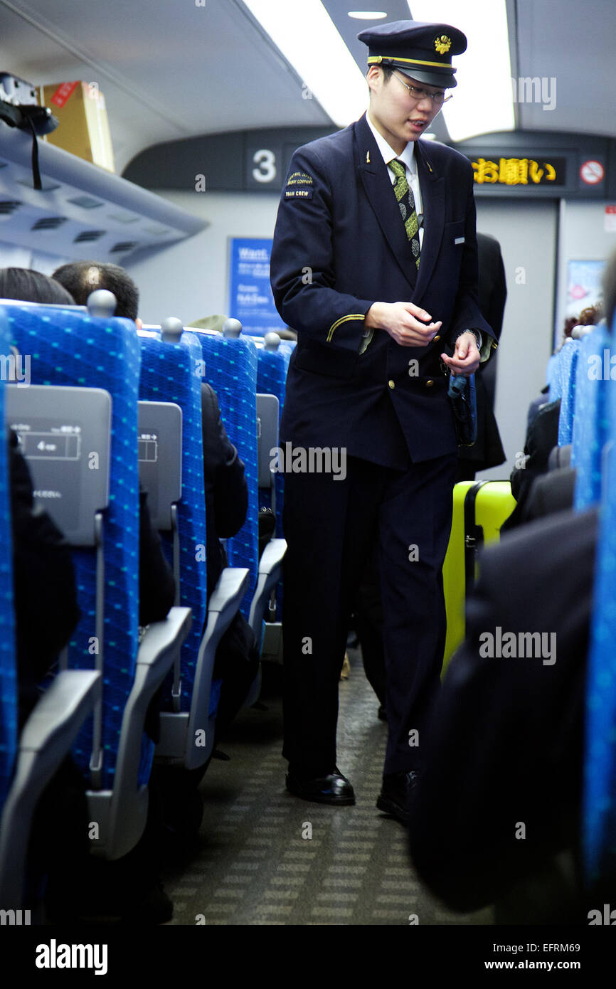 Osaka, JP - January 21, 2015 : A Japanese conductor of Shinkansen ...