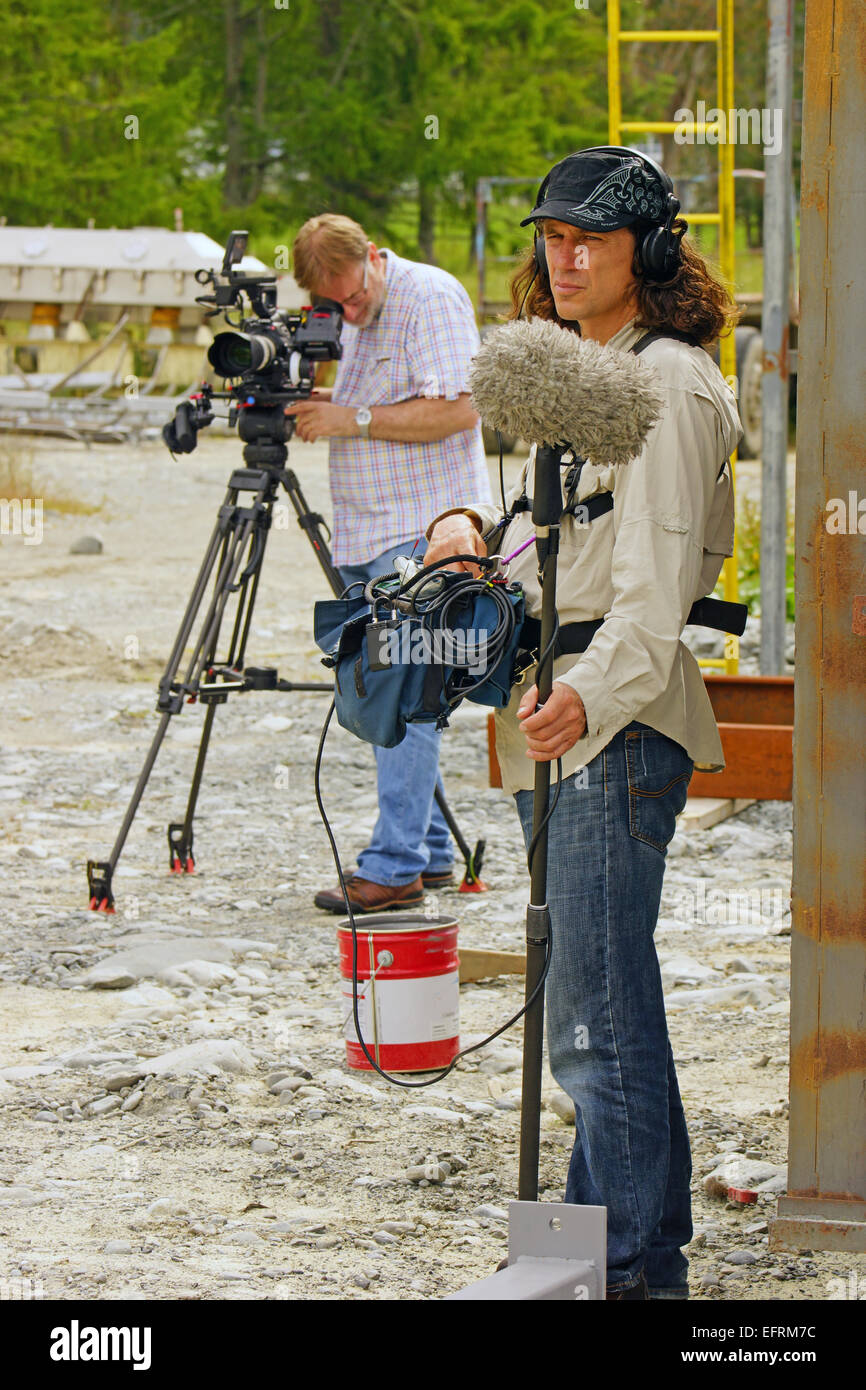 A documentary cameraman and his sound recordist at work on location ...