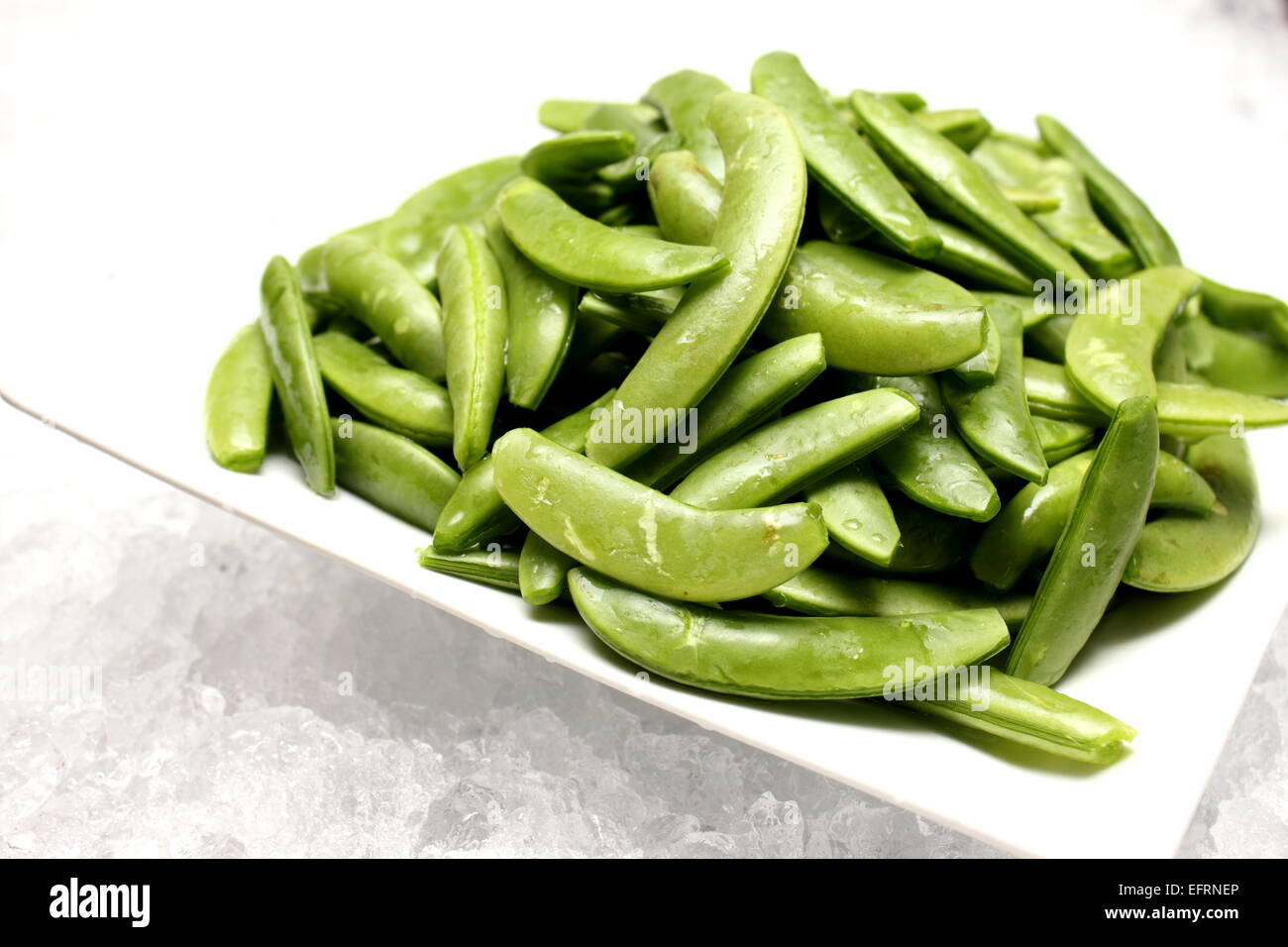 French green bean string on white background Stock Photo - Alamy