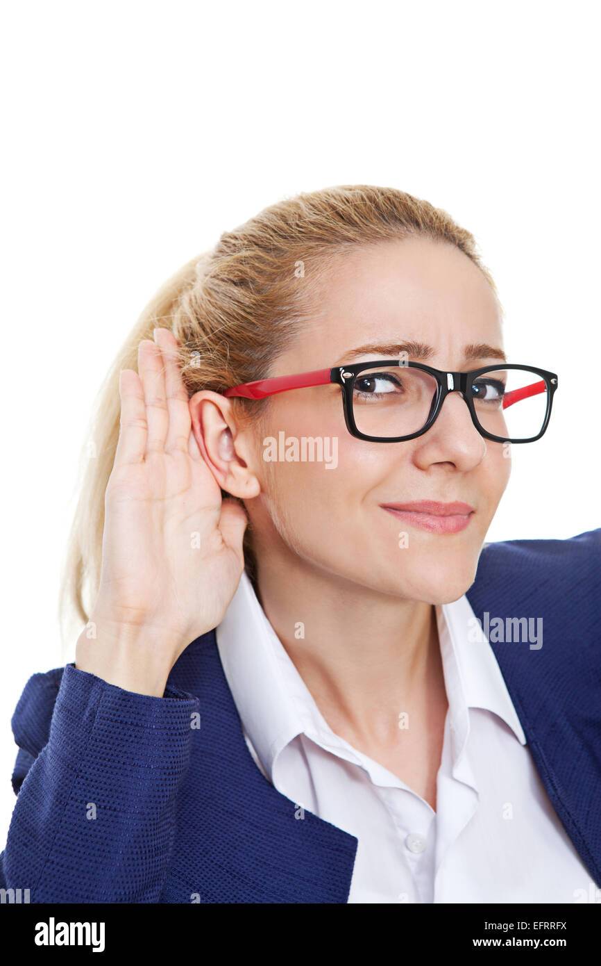 Woman with hand to ear listening on the white Stock Photo - Alamy