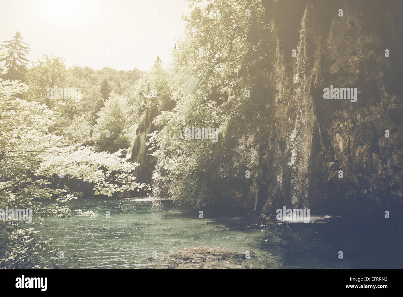 Retro Waterfall with Sunlight with Vintage Film Style Stock Photo - Alamy