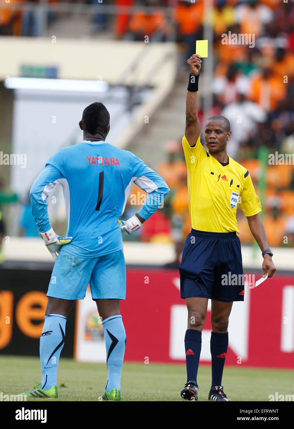 Guinea goalkeeper Naby Yattara is show a yellow card against Ghana ...