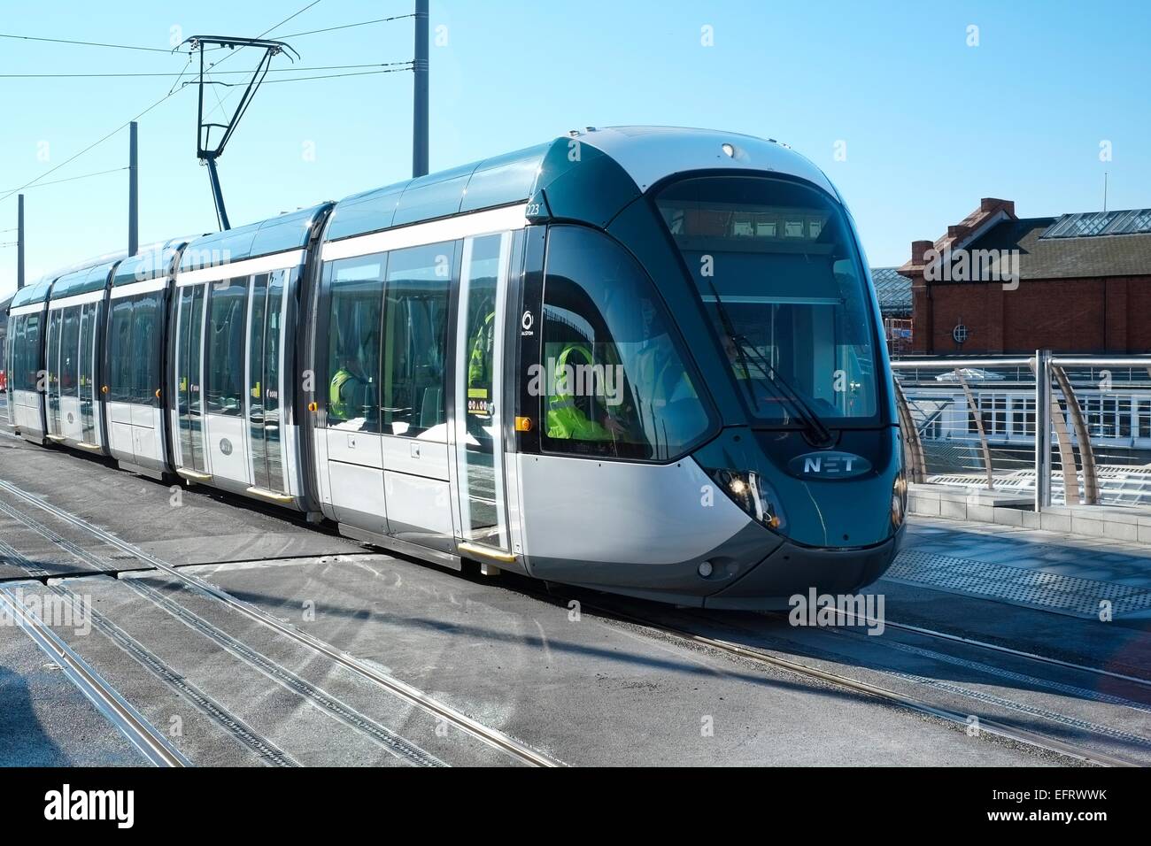 Modern electric tram running on the Nottingham express transit system ...