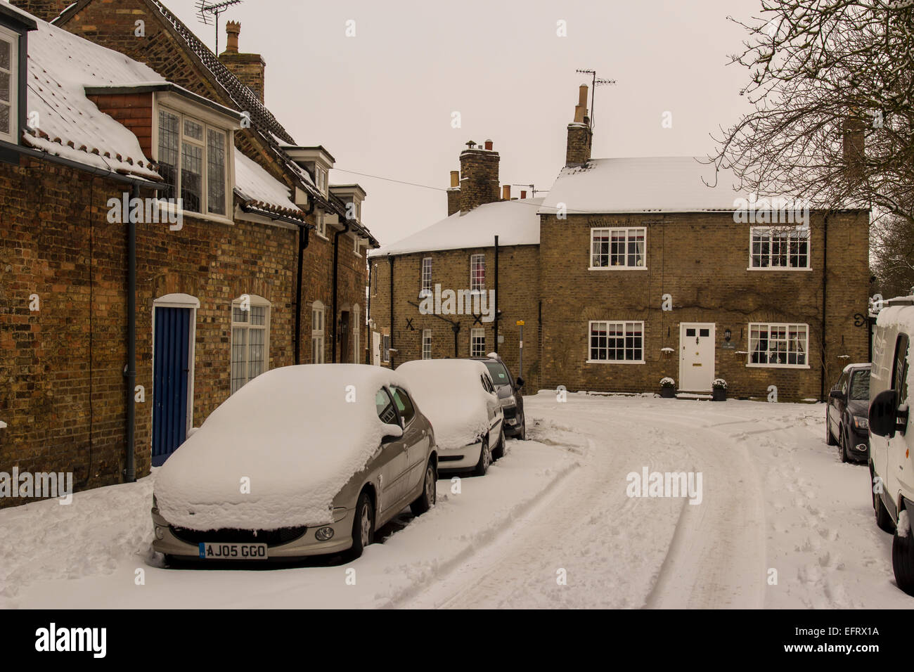 Photograph of Church Street Thorney in the Snow Stock Photo - Alamy