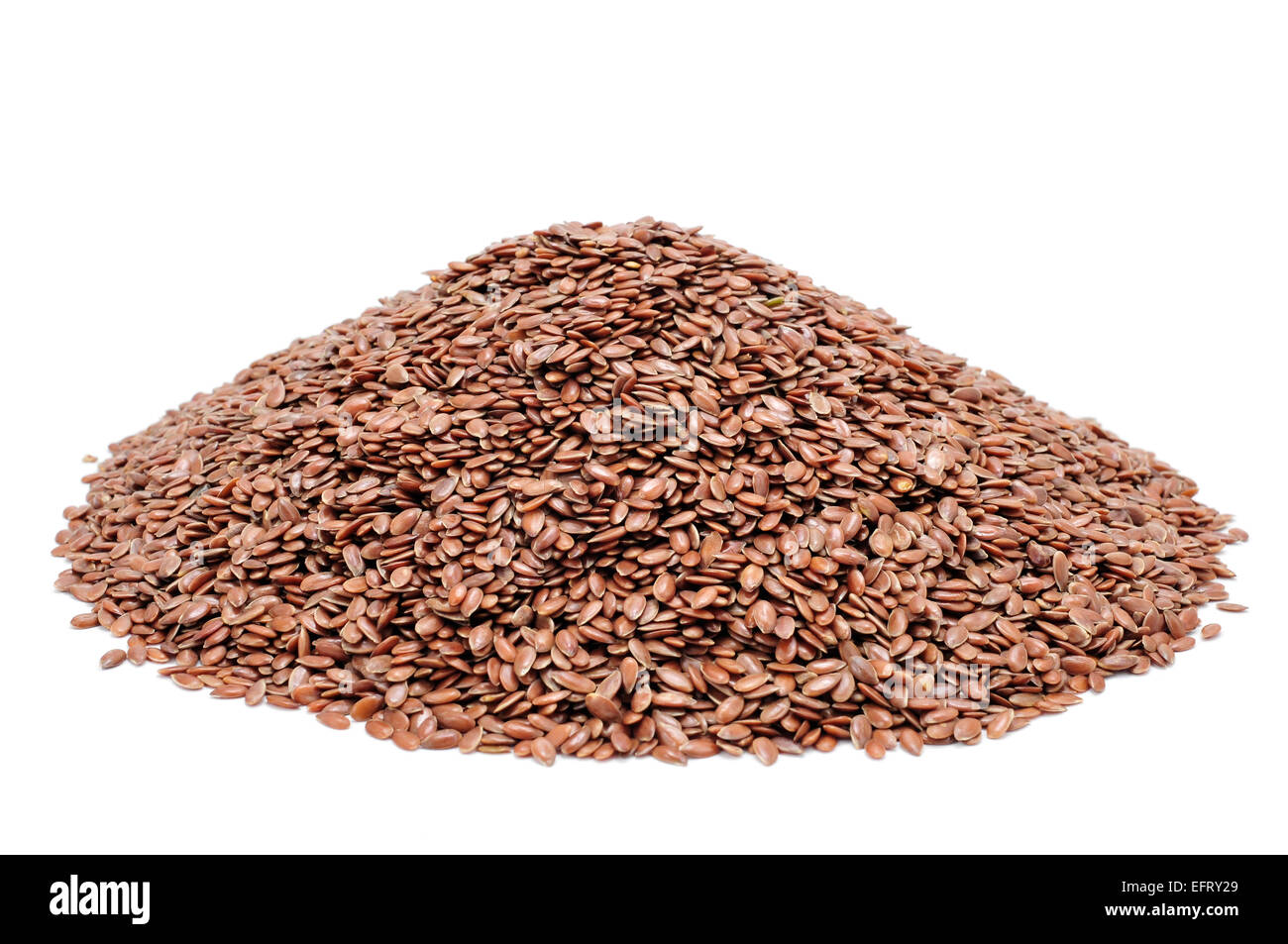 a pile of brown flax seeds on a white background Stock Photo - Alamy