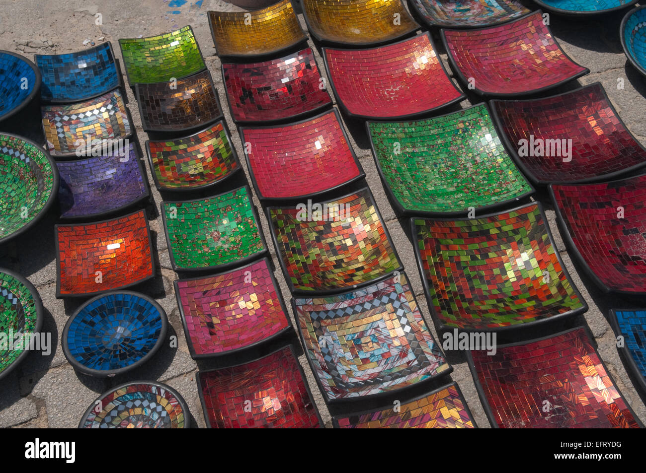 Traditional Arabic decorative mosaic plates are laid out on the square ...